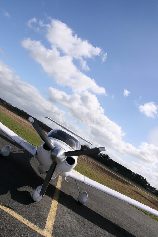 White plane and clouds stock image. Image of airfield - 2447707