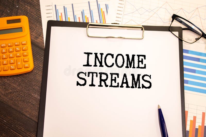 INCOME STREAMS - Words on a White Sheet Against the Background of a ...
