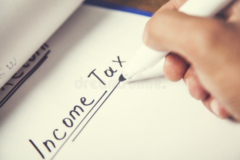 Income tax text on paper stock photo. Image of business - 152956192
