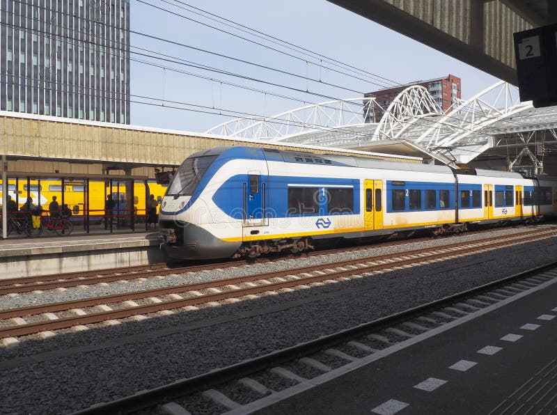 Incoming Regional Train in Leiden Centraal Station with People Standing ...