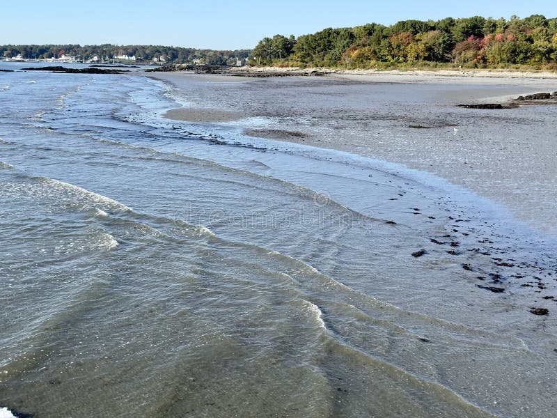 Incoming tide at the ocean stock photo. Image of ocean - 258446348