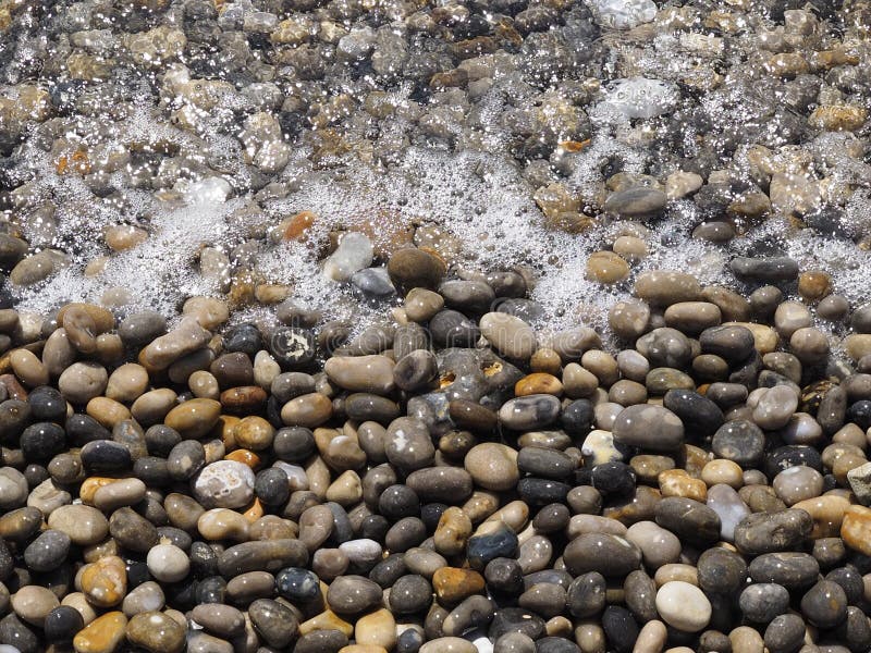 Incoming Tide on a Pebble Beach Stock Image - Image of 2024, pebbles ...