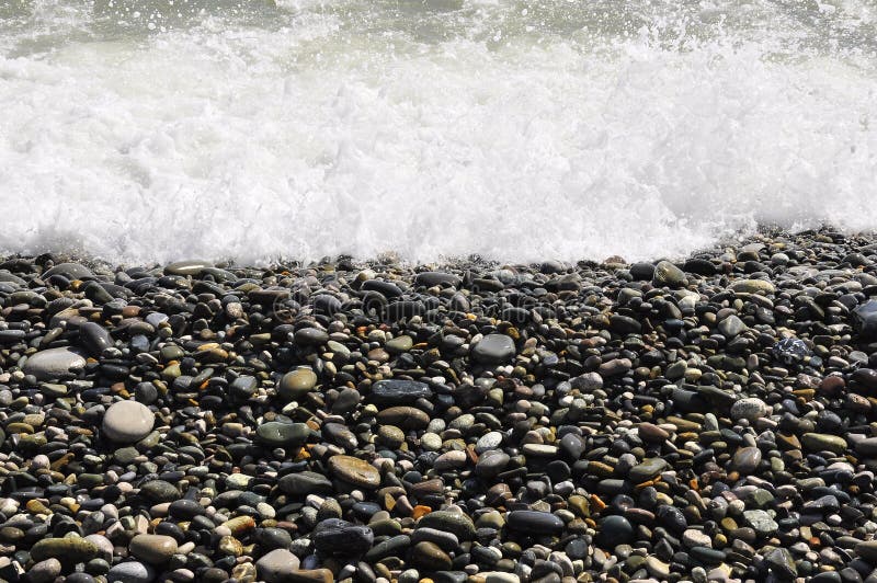 Sea wave on pebble beach stock photo. Image of relax - 65631826