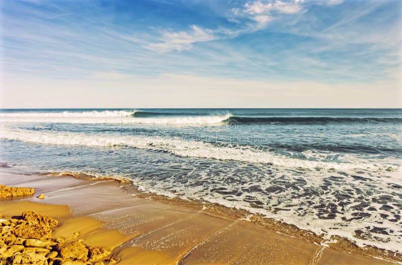 Incoming Waves Rolling into a Rocky Shore Stock Photo - Image of beach ...