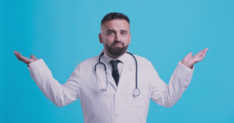 Incompetent Medical Doctor Spreading His Hands, Blue Background Stock ...