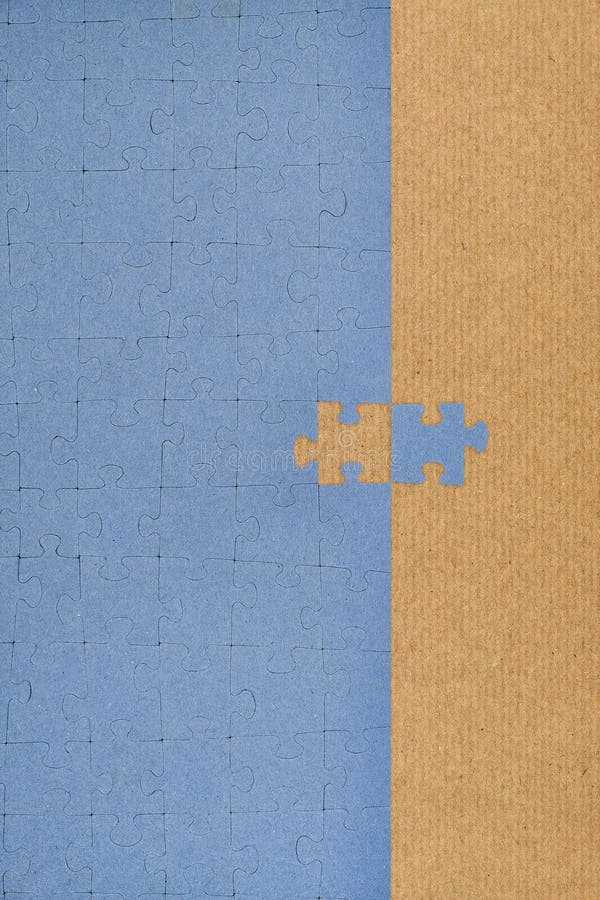 Incomplete Blue Jigsaw Puzzle with a Missing Piece Placed on Brown ...