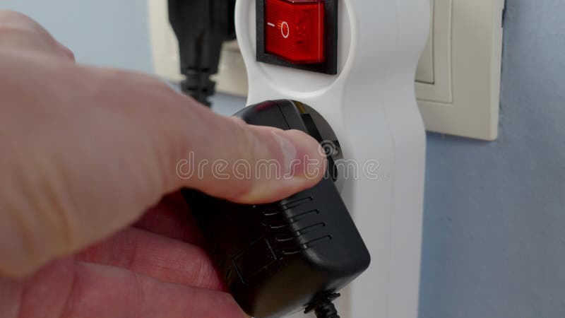 Plugging a Euro Banknote into an Electrical Outlet with a Red Switch ...