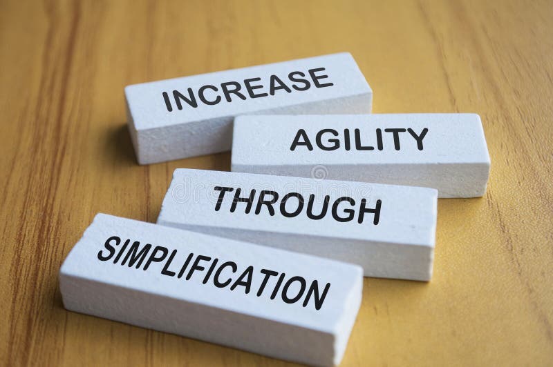 Increase Agility through Simplification Text on White Wooden Blocks ...