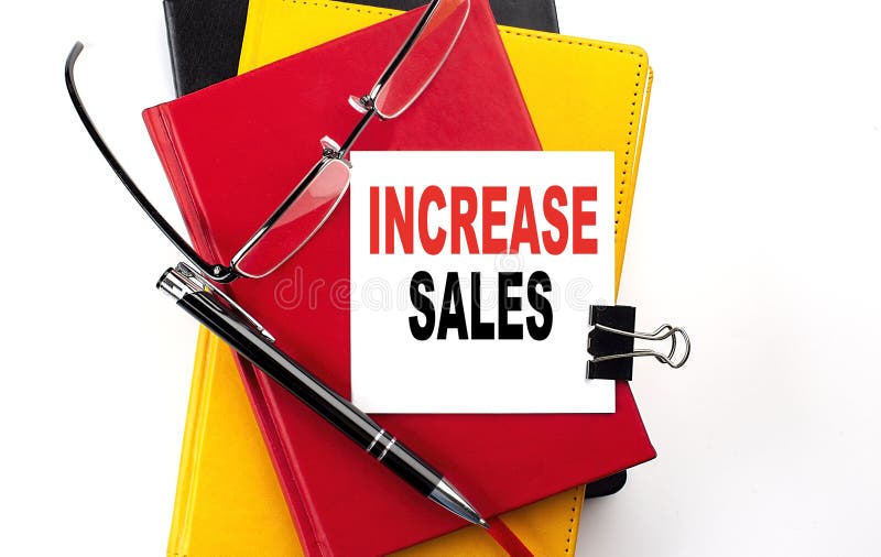 INCREASE SALES Text Written on a Sticky on Colorful Notebooks Stock ...