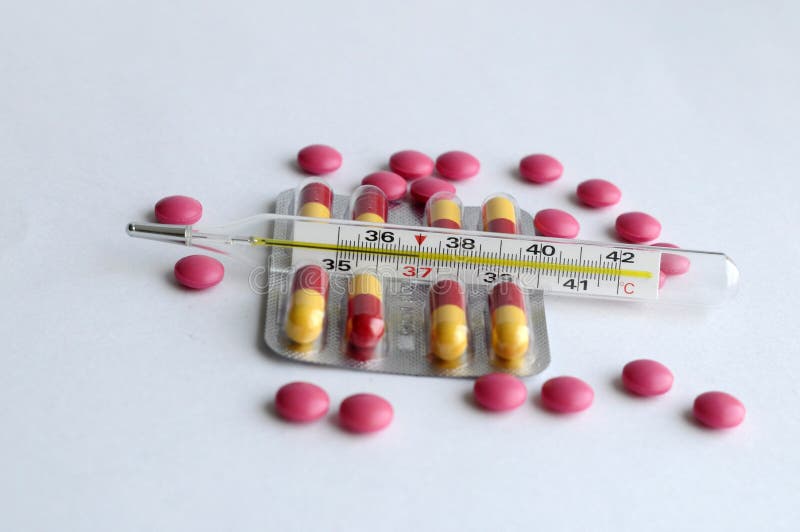 The Increased Temperature on a Thermometer, Pills and Tablets. Stock ...
