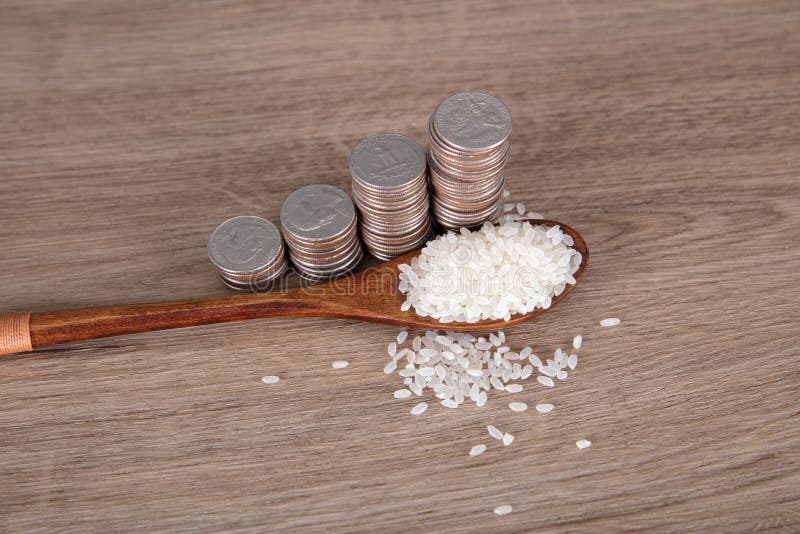 Increasing Dollar Coins and Rice Stock Image - Image of spoon, spoonful ...