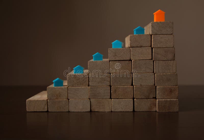 Increasing House Models Arranged in a Row on Wooden Stack Staircase ...