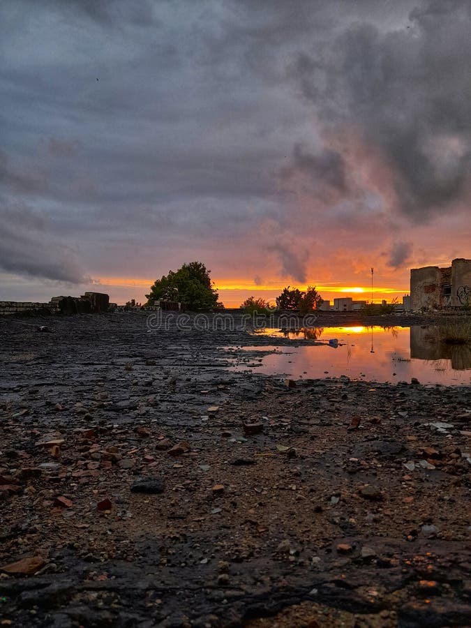 Post-apocalyptic Sunset Sky Over the Roof of an Abandoned Factory Stock ... Post-apocalyptic Sunset Sky Over the Roof of an Abandoned Factory Stock ...
