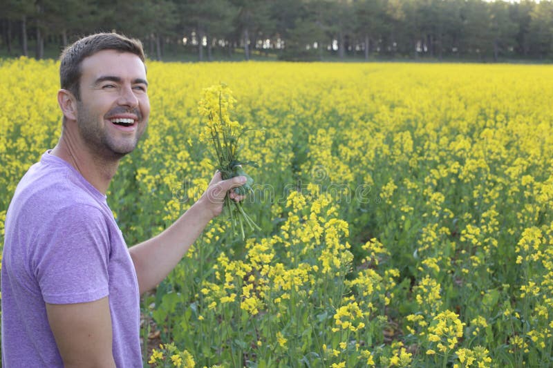 Incredibly Cute Man Offering Yellow Flowers Stock Image - Image of gift ...