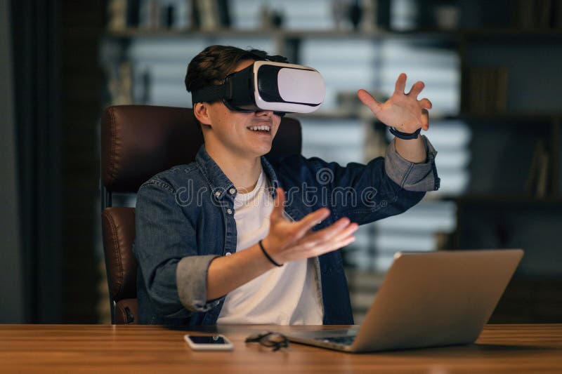 Independent Contractor Using Laptop and Wireless VR Headset at ...