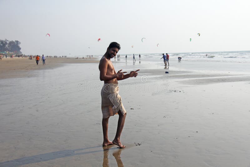 India, GOA, January 28, 2018. a Man by a Passer-by is Posing on the ...