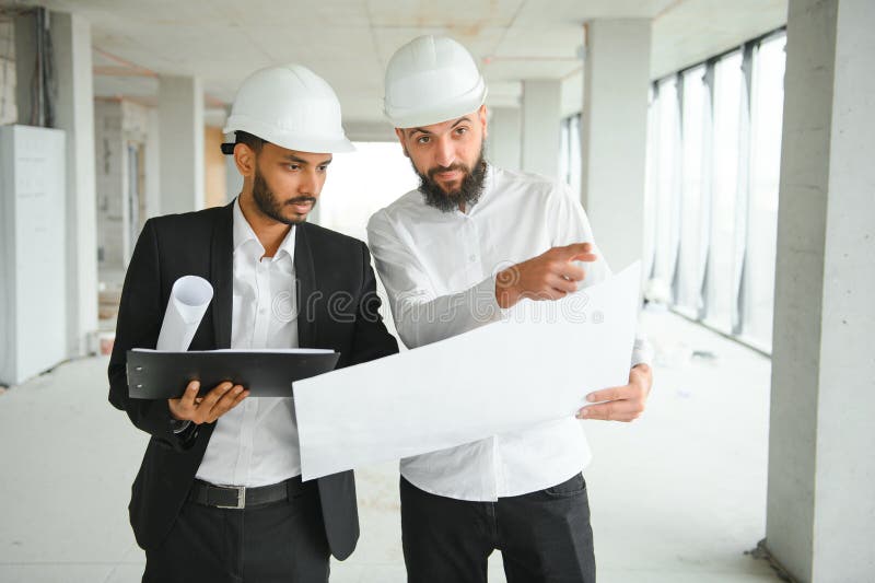 Indian and Arabian Engineers. Contractor and Architect Talking about ...
