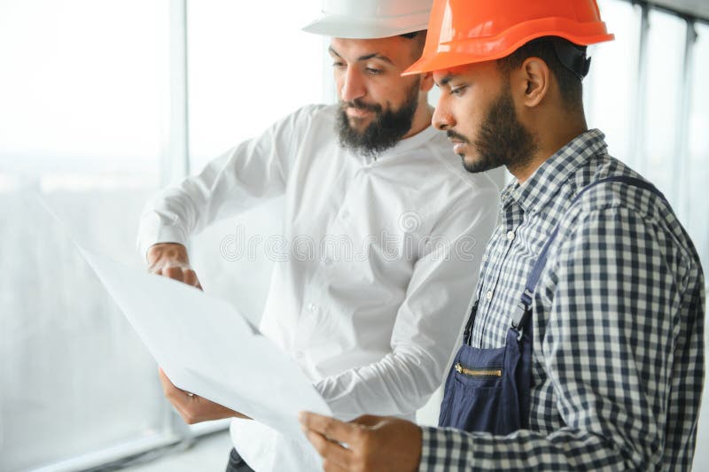 Indian and Arabian Engineers. Contractor and Architect Talking about ...