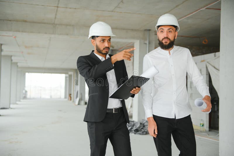 Indian and Arabian Engineers. Contractor and Architect Talking about ...
