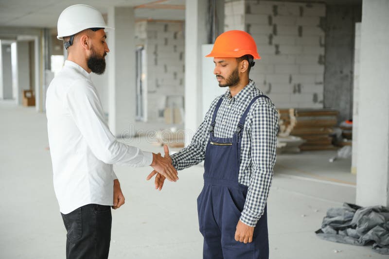 Indian and Arabian Engineers. Contractor and Architect Talking about ...