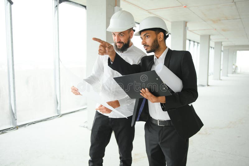 Indian and Arabian Engineers. Contractor and Architect Talking about ...