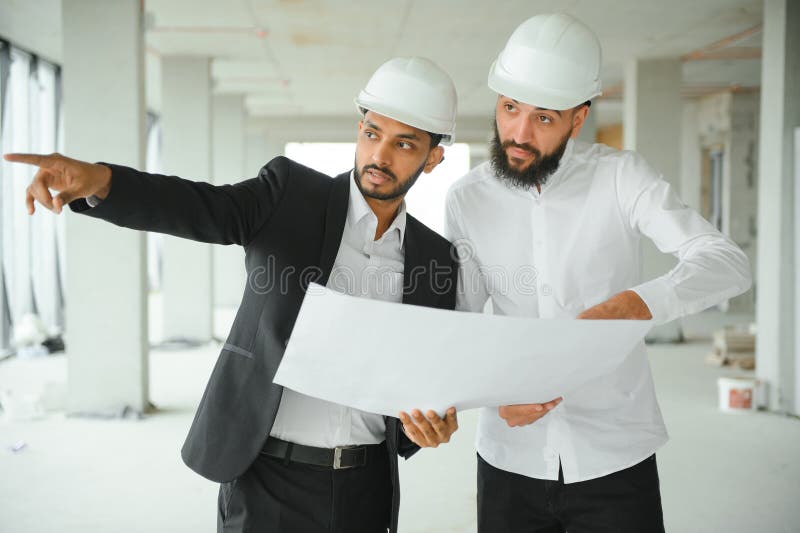 Indian and Arabian Engineers. Contractor and Architect Talking about ...