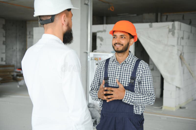 Indian and Arabian Engineers. Contractor and Architect Talking about ...