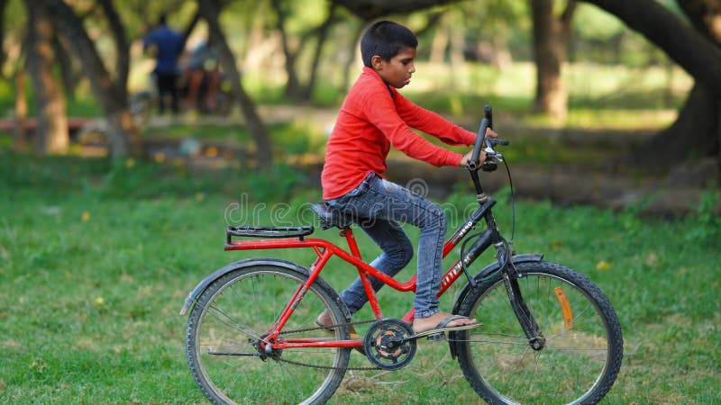 Indian Boy Learning To Cycle in the Park Editorial Image - Image of ...