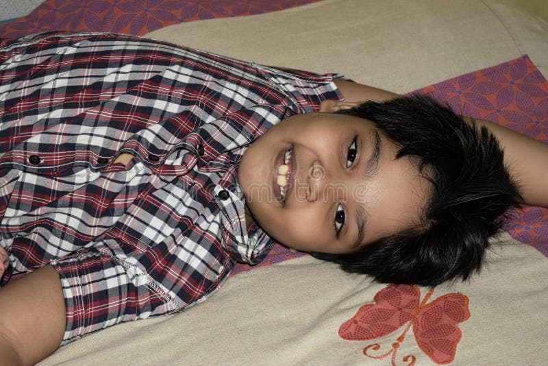 Indian Boy Taking Rest in a Joyous Smiling Face Stock Image - Image of ...