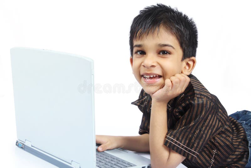 Indian Boy using laptop stock photo. Image of computer - 24975830