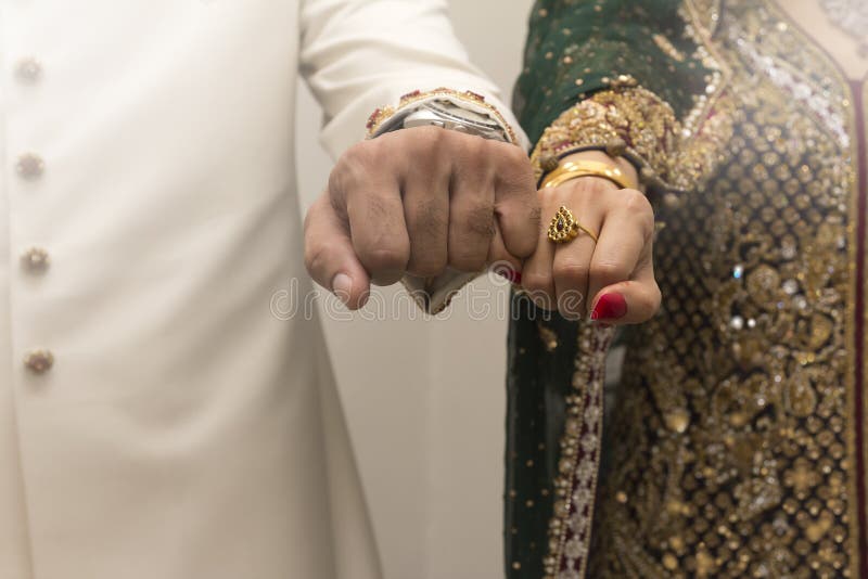Muslim Indian Bride And Groom Holding Hands
