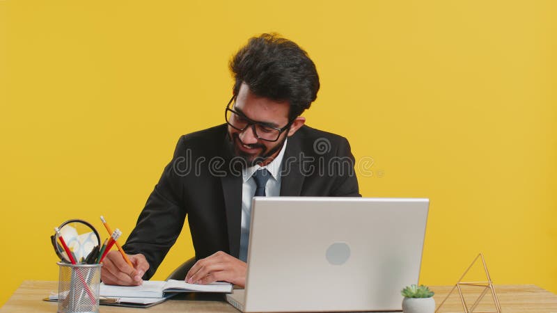 Indian Businessman Making Notes, Writing Down Thoughts with Pen into ...