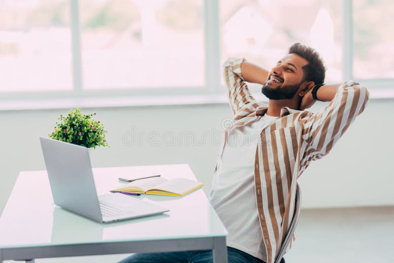 Indian Businessman Relaxing from Work in the Office Stock Image - Image ...