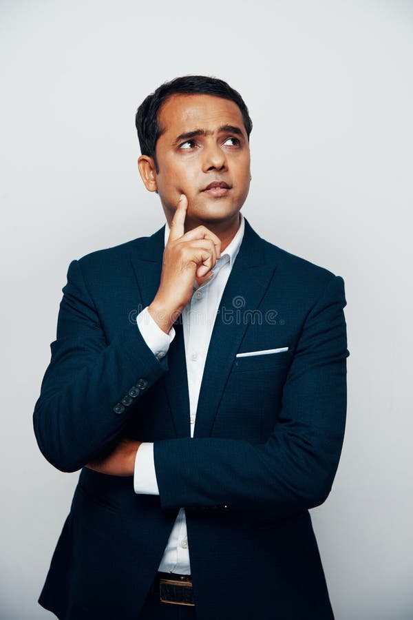 Indian Businessman Thinking Stock Photo - Image of standing, indian ...