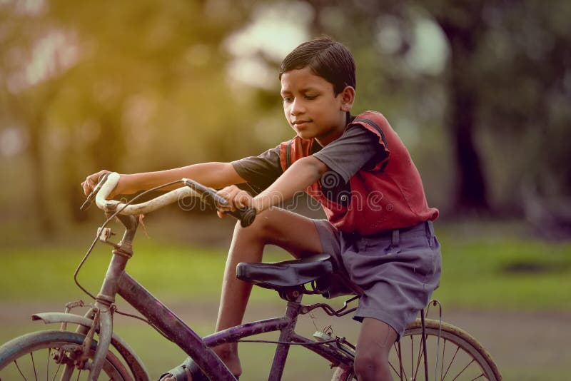 Indian child on bicycle stock photo. Image of india - 133131506