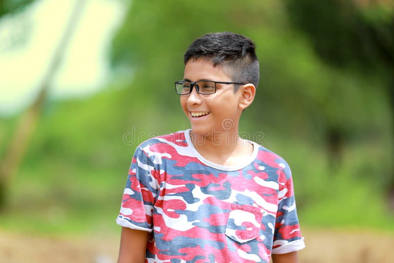 Indian child on eyeglass stock image. Image of confident - 95809379