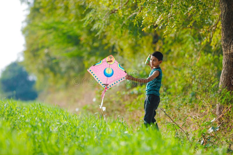 Indian Child Playing with Kite at Green Field Stock Photo - Image of ...