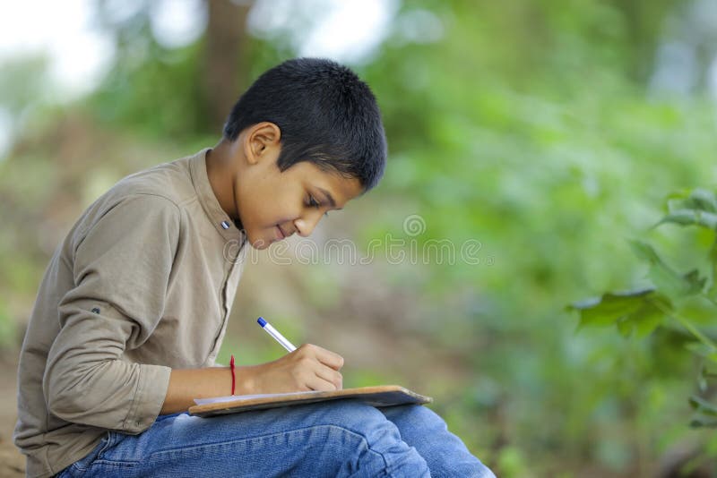 Indian Child Writing on Note Book Stock Image - Image of happiness ...