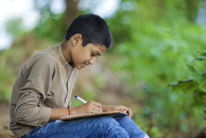 Indian Child Writing on Note Book Stock Image - Image of child ...