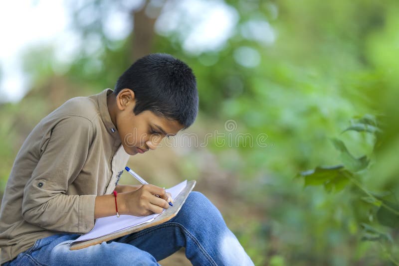 Indian Child Writing on Note Book Stock Image - Image of book, child ...