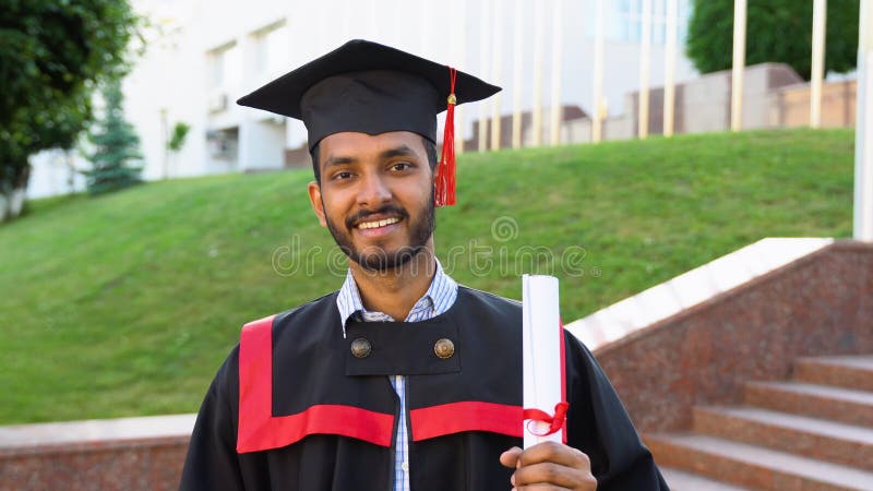 Indian College Graduate in Cap and Gown Walking in Campus Stock Footage ...