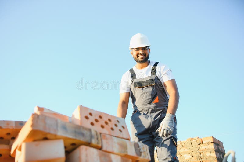 Indian Construction Worker Man in Work Clothes and a Construction ...