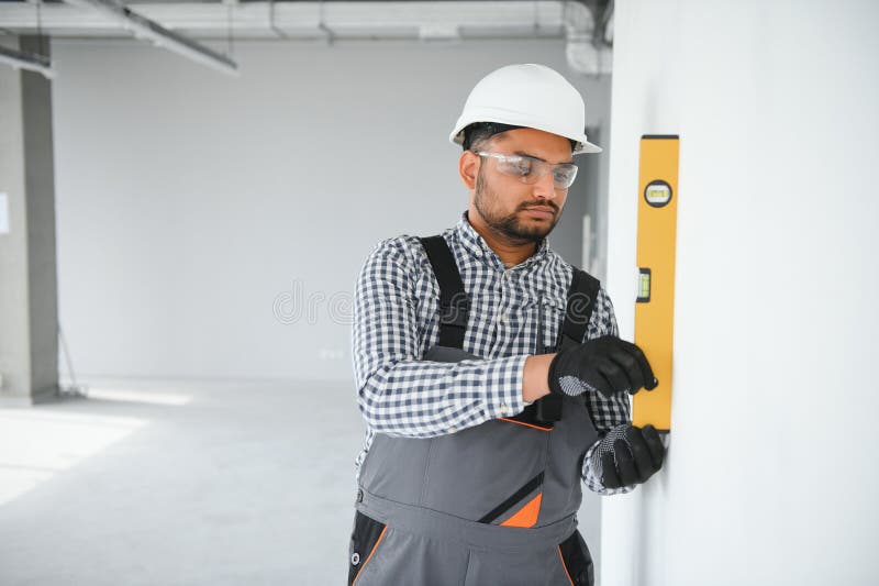 Indian Construction Worker with Mustache Uses Water Level Measuring ... Indian Construction Worker with Mustache Uses Water Level Measuring ...