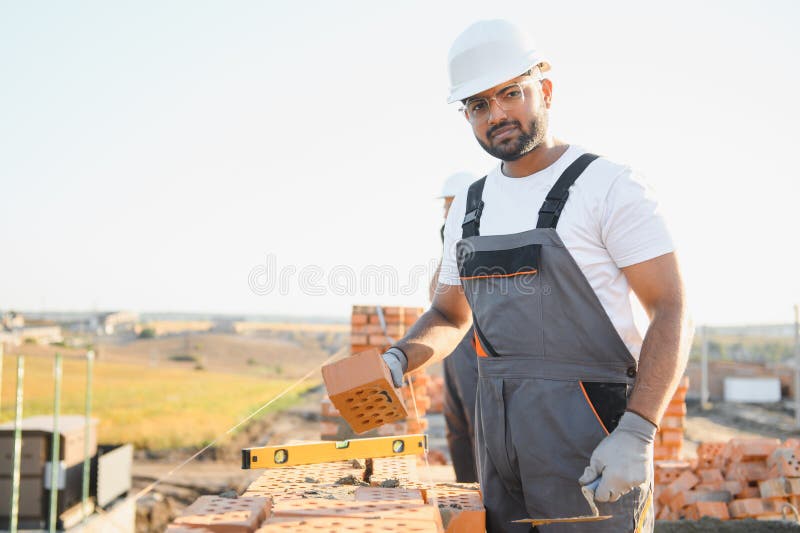 Indian Construction Workers Work on the Construction of a Brick House ...