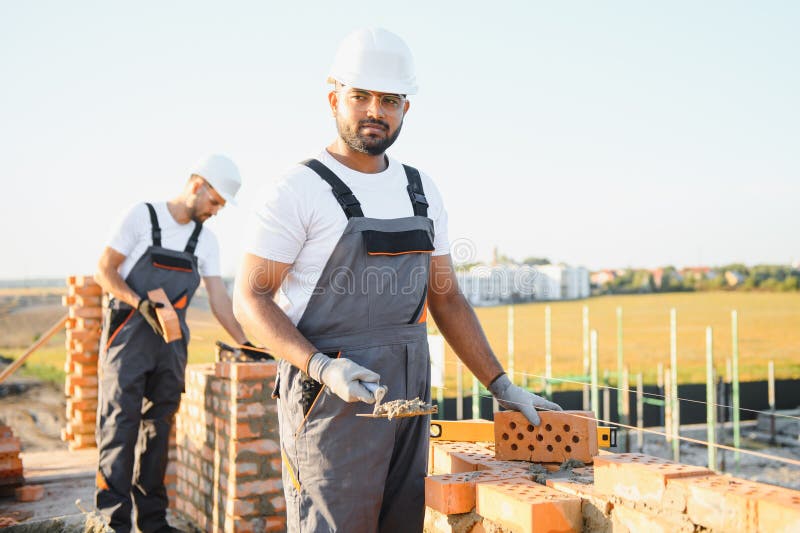 Indian Construction Workers Work on the Construction of a Brick House ...