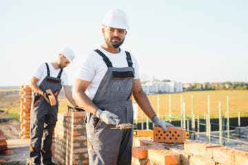 Indian Construction Workers Work on the Construction of a Brick House ...