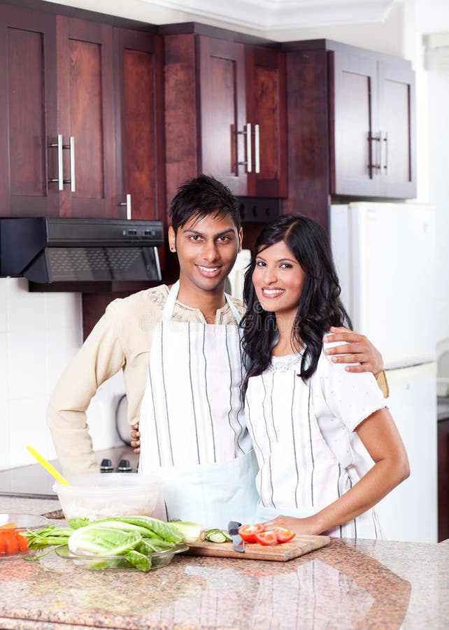 Indian couple in kitchen stock image. Image of couple - 23391463