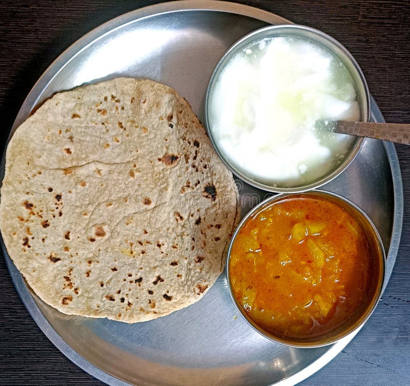 Indian Cuisine Loki Curry and Roti or Chapati with Curd Served in a ...