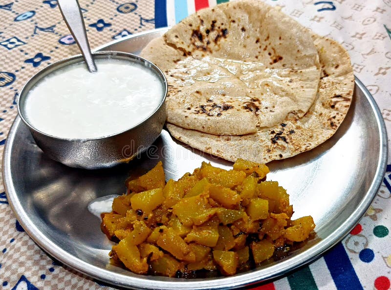 Indian Cuisine Loki Curry and Roti or Chapati with Curd Served in a ...