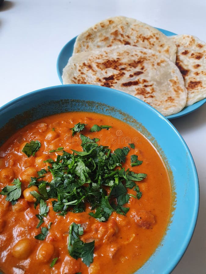 Indian Curry in a Bowl with Bread or Roti. Stock Photo - Image of ...